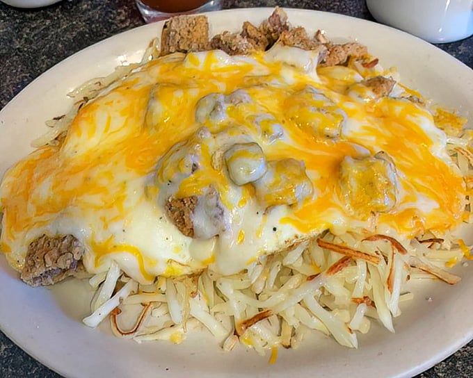 The legendary "5 Car" breakfast—named because you'll need five cars to tow you home after finishing this cheese-smothered masterpiece of excess.