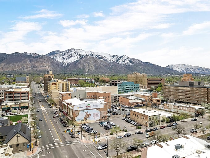 An aerial view reveals Ogden's perfect positioning—urban amenities nestled against mountain wilderness, offering the best of both worlds without Manhattan prices.
