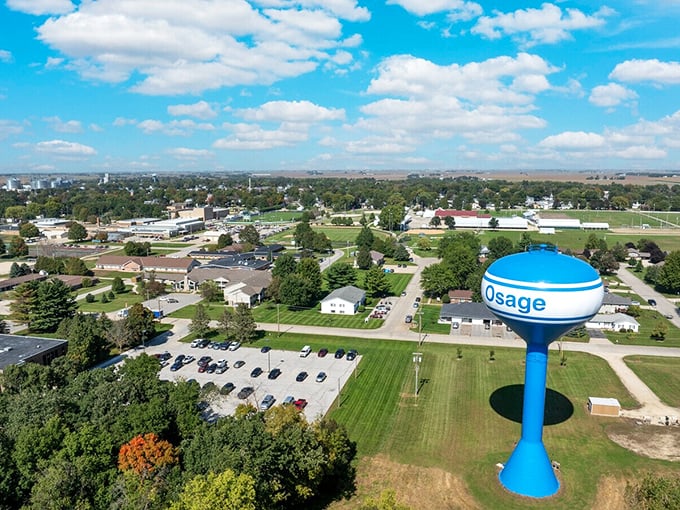 The iconic blue water tower stands sentinel over Osage—a beacon of small-town pride visible from miles across the prairie.