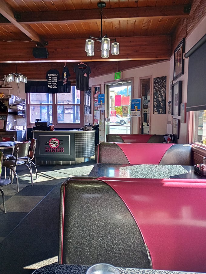 Pink booths bathed in morning light—where calories don't count and coffee comes with a side of Colorado sunshine.