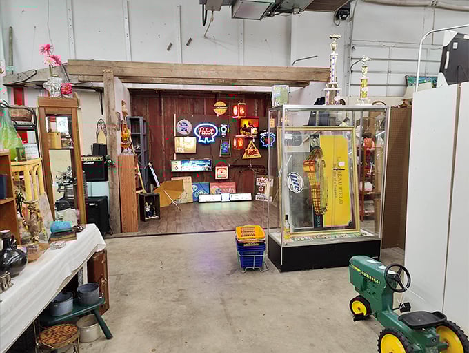 Vintage neon signs illuminate this man-cave paradise – where beer advertisements become art and garage memorabilia gets the respect it deserves.