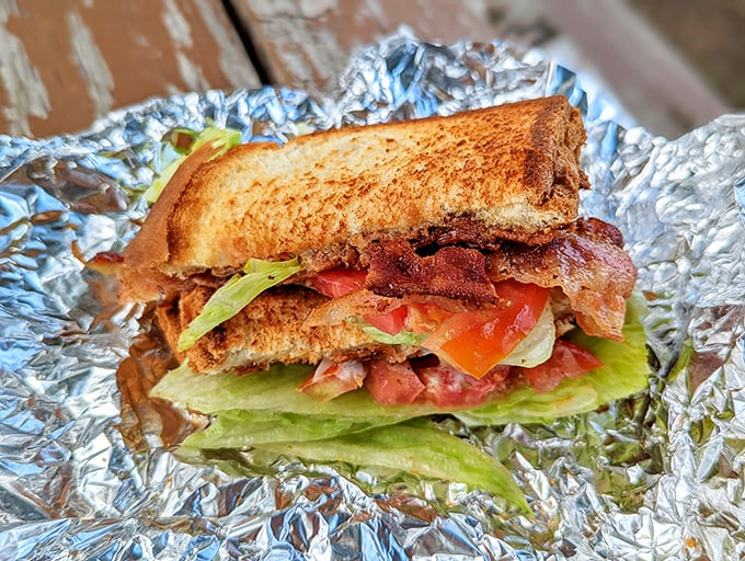 This isn't just a BLT; it's architecture—a carefully constructed tower of crispy bacon, garden-fresh vegetables, and toasted perfection.