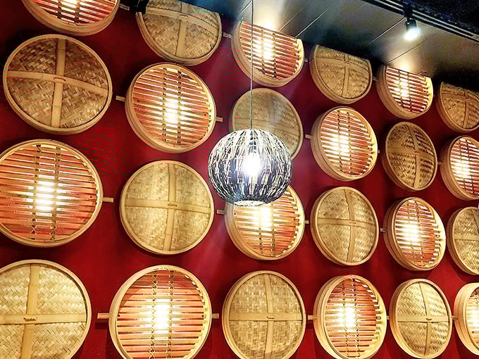 Traditional bamboo steamers line the wall, both functional and decorative – the ancient technology still perfect for modern deliciousness.