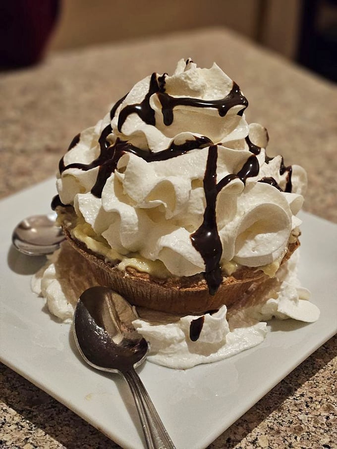 This banana cream tart isn't just dessert—it's performance art, with chocolate drizzles creating a Jackson Pollock masterpiece you can actually eat.