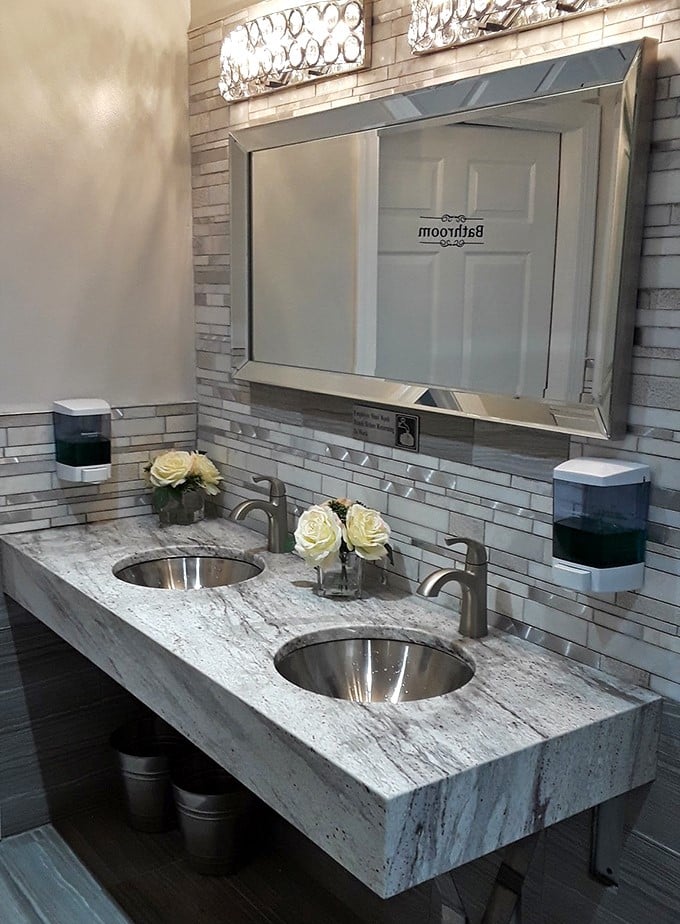 Even the restroom speaks to the attention to detail—marble countertops and fresh flowers elevate the entire experience.