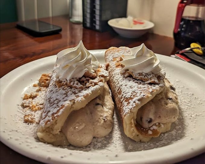 These aren't just cream-filled pastries—they're edible love letters dusted with powdered sugar and topped with whipped cream exclamation points.