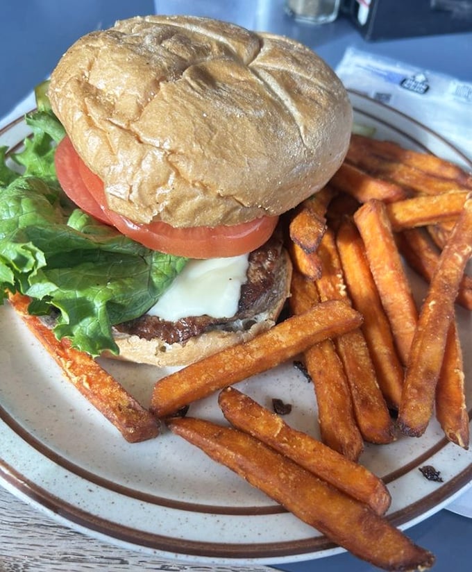 A burger and sweet potato fries that prove The Countrie Eatery isn't just a breakfast one-hit wonder—it's an all-day greatest hits album.