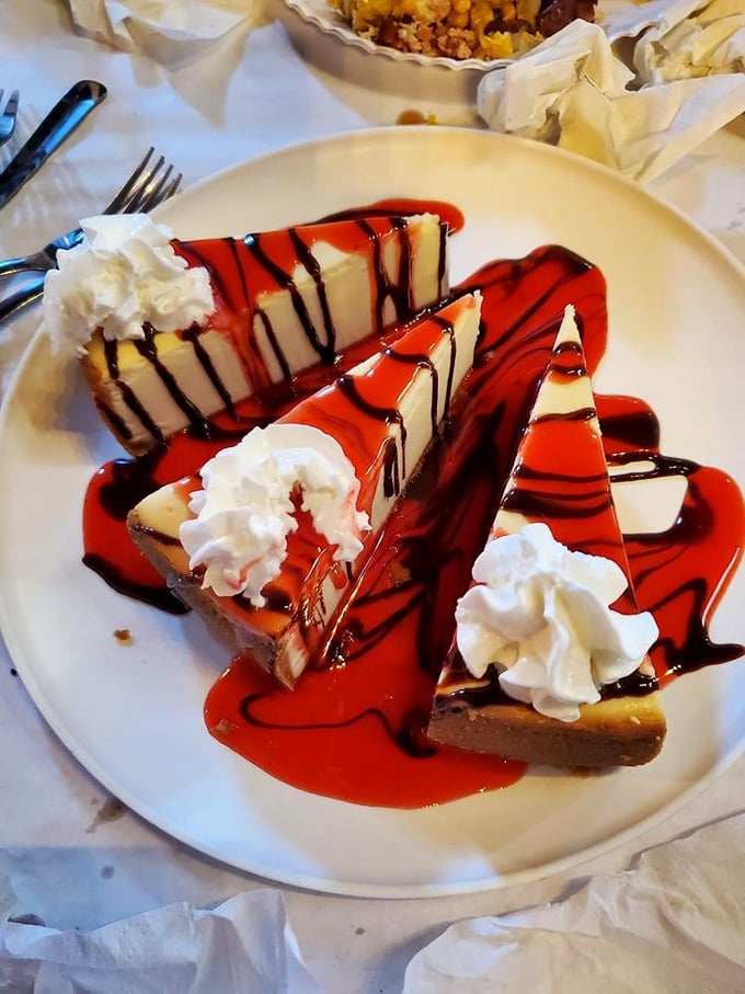 Cheesecake drizzled with raspberry sauce—because after battling crab legs and peeling shrimp, you've earned this sweet finale.