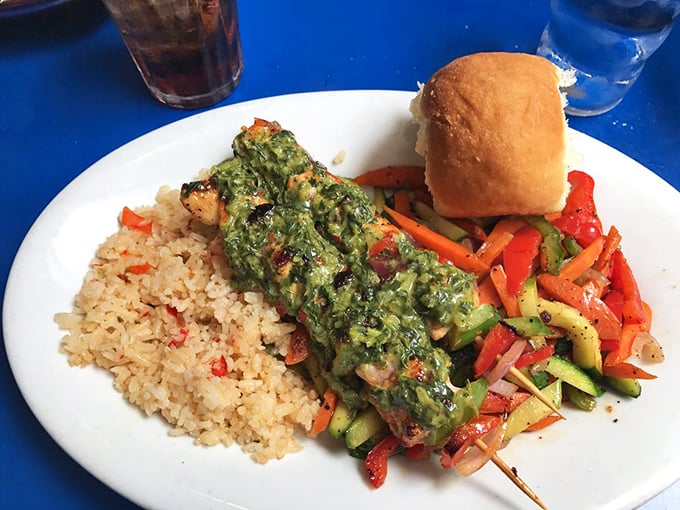 A plate that proves healthy can be exciting—vibrant vegetables, perfectly grilled protein, and rice that's absorbed all the right flavors. Vacation on a plate.