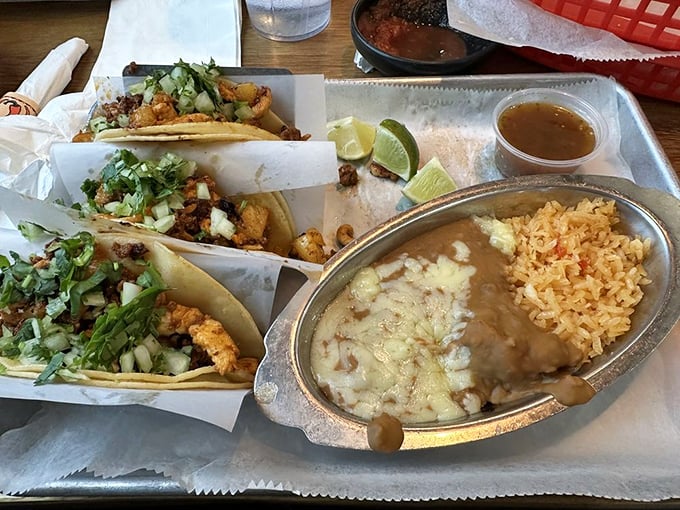 Street tacos served unpretentiously—proof that sometimes the simplest presentations deliver the most complex flavors.