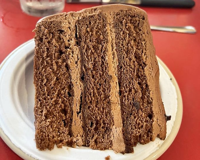 Chocolate cake so rich and decadent it should come with its own tax bracket—layers of cocoa perfection that demand to be savored.