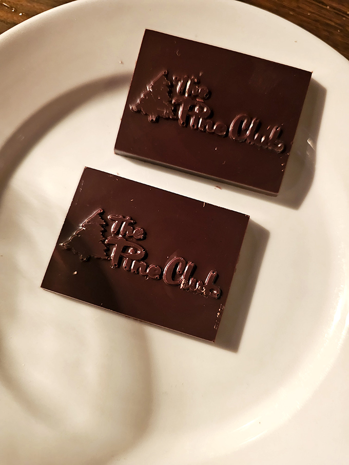 Even the chocolate squares bear The Pine Club's mark – a sweet finale stamped with the promise you'll be back.