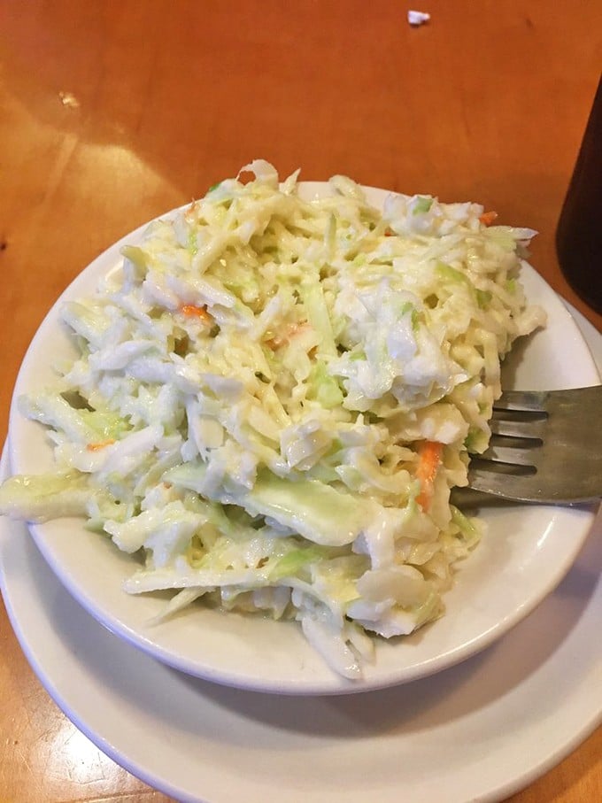 A proper diner coleslaw—crisp, fresh, and the perfect counterpoint to whatever hearty main course you've wisely ordered.