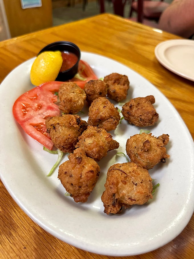Conch fritters golden-brown and crispy on the outside, tender within – a taste of the Bahamas that found its perfect home in the Florida Keys.