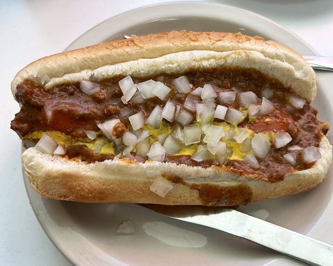 Behold the anatomy of perfection: steamed bun, snappy dog, seasoned chili, sharp onions, and yellow mustard—Detroit's most perfect equation.
