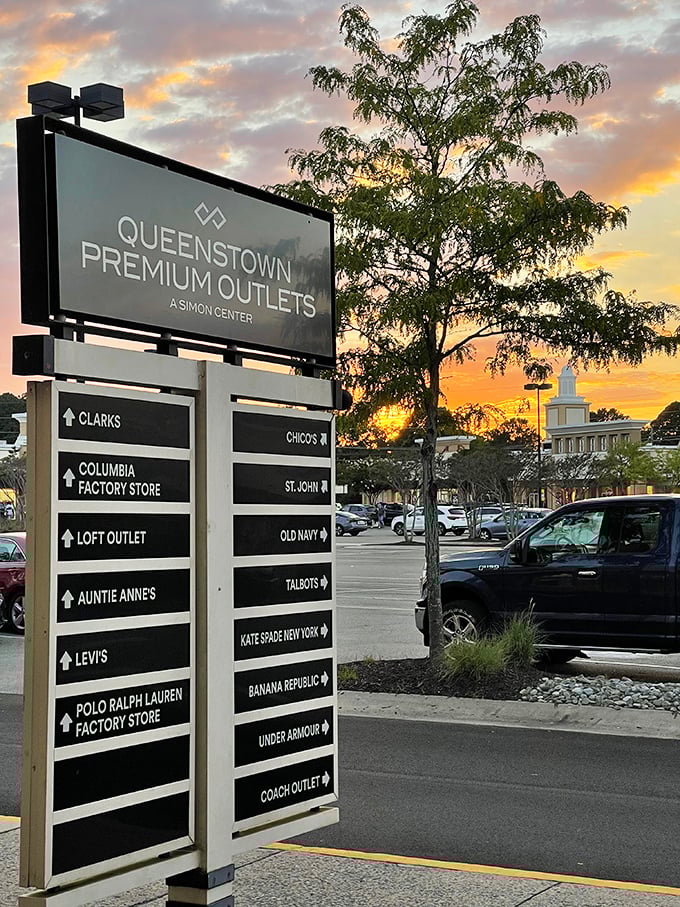 The directory sign at sunset—a retail rosetta stone guiding shoppers through this labyrinth of bargains as day gives way to evening.
