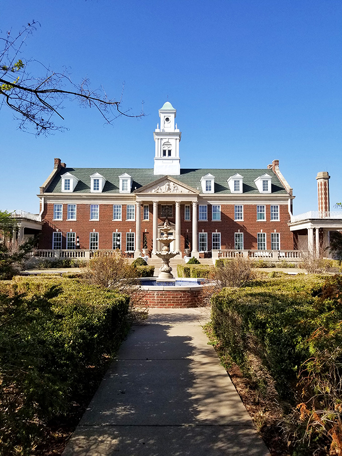 Dominion House stands like a Georgian manor that took a wrong turn and decided Oklahoma suited it just fine.
