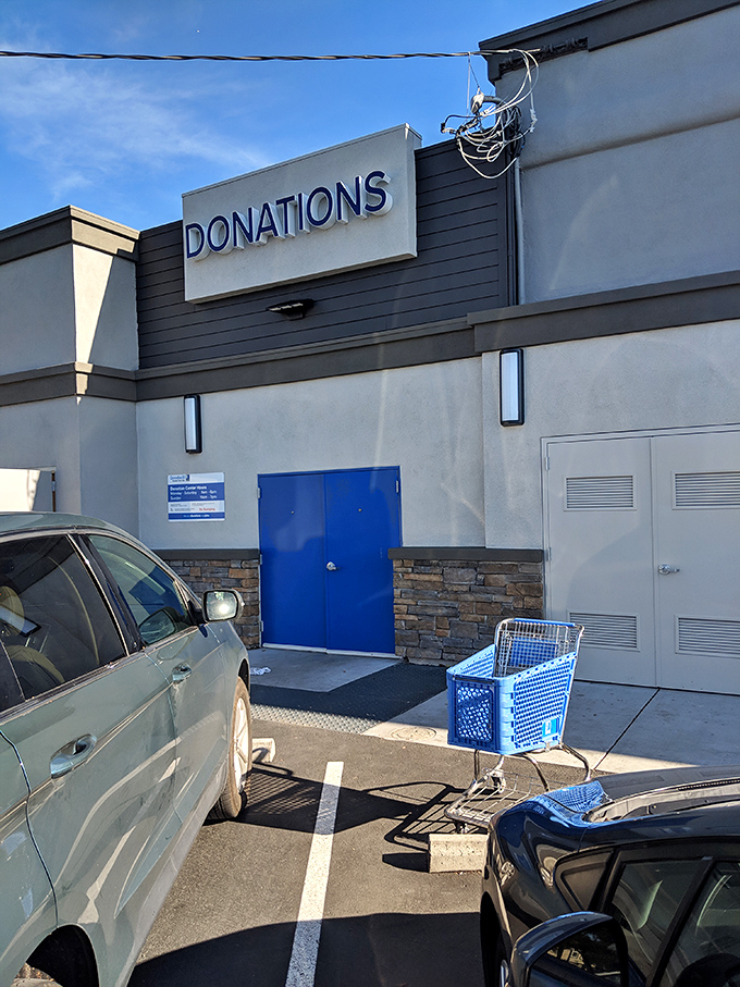 The "Donations" sign marks the circle of thrift life—where yesterday's closet cleanout becomes tomorrow's triumphant find for someone else.