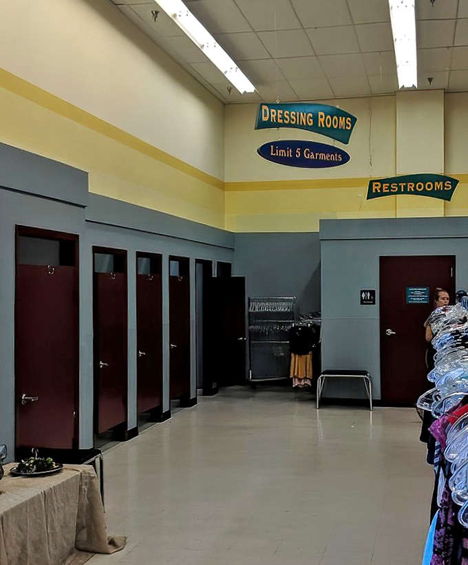 The dressing room area—where fashion dreams are tested against reality with a five-garment limit and fluorescent lighting honesty.