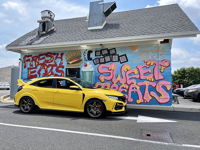 The vibrant mural doesn't just decorate the building—it announces to the world that something extraordinary happens inside these walls, one burger at a time.
