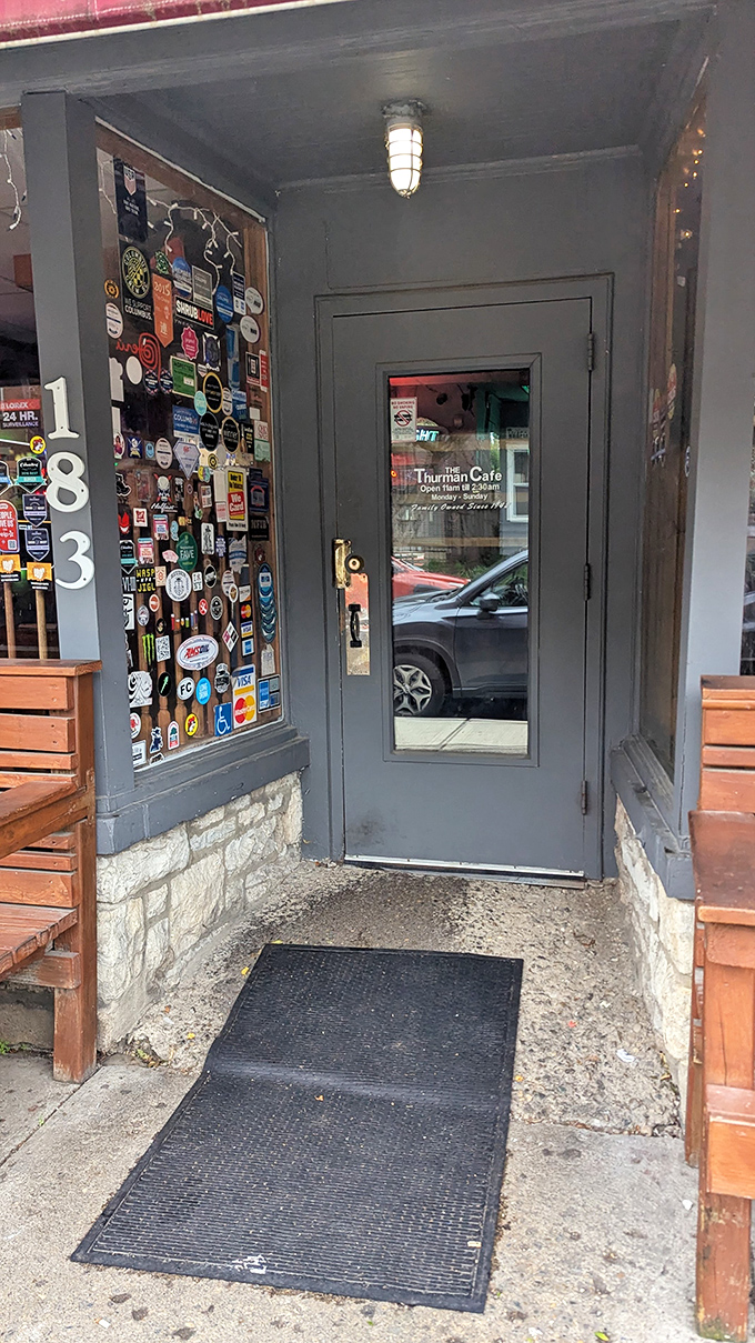 The sticker-covered entrance serves as a guest book of sorts, each decal a testament to pilgrims who've made the journey to burger paradise.