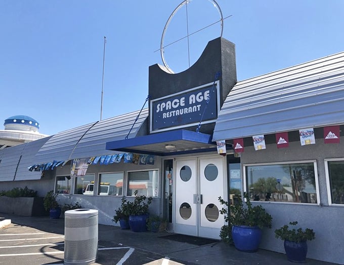 Those round porthole doors aren't just for show—they're your gateway to an otherworldly dining experience in the heart of the Sonoran Desert.