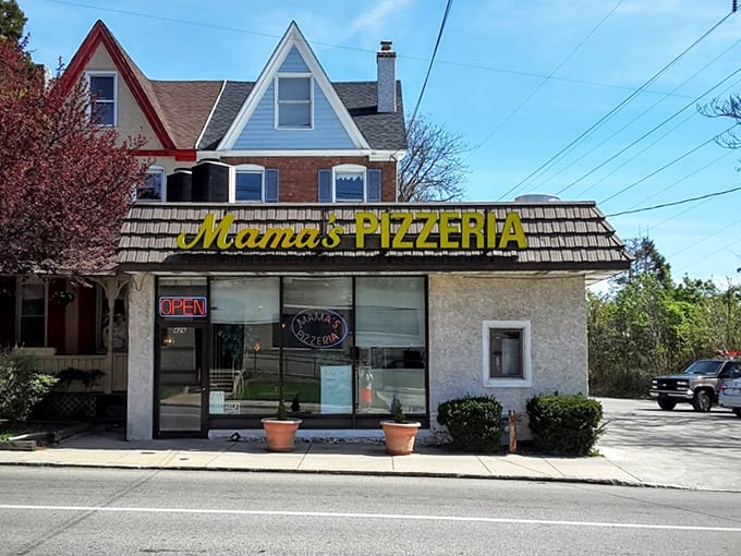 The street view reveals Mama's true character—a neighborhood institution nestled among residential homes, serving its community one perfect sandwich at a time.