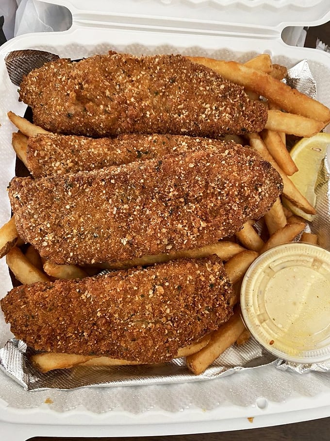 Fish and chips, Maryland-style. That crispy coating isn't just breading—it's armor protecting the tender fish within until the perfect first bite.