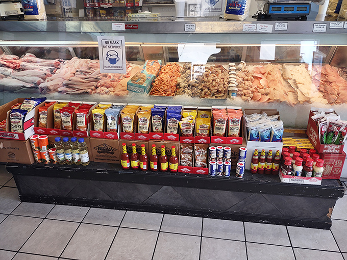That fresh seafood display case showcasing today's catches alongside packaged goods for your at-home cooking adventures.