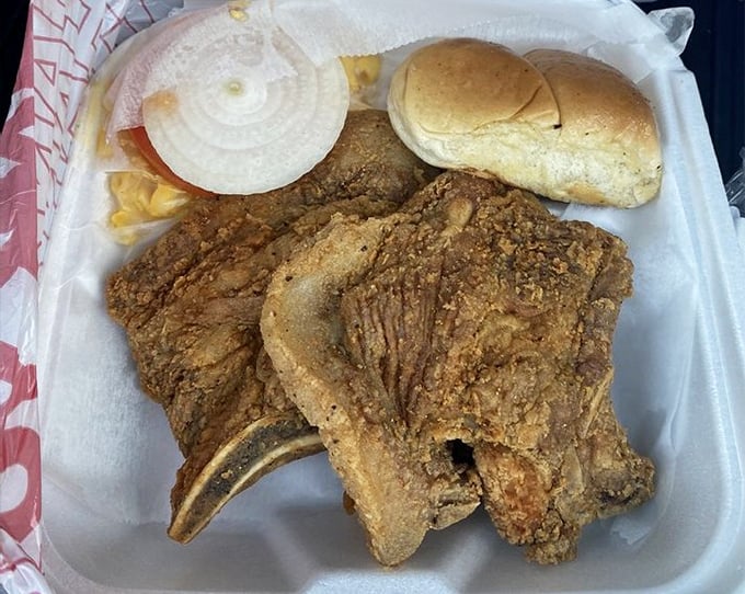 A pork chop sandwich that means business – hearty, hand-breaded, and served with all the fixings. This isn't lunch; it's an Alabama institution on a bun.