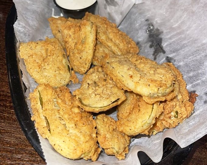 Fried pickles that deliver that perfect pucker-crunch combination—the appetizer that converts skeptics into evangelists with just one bite.