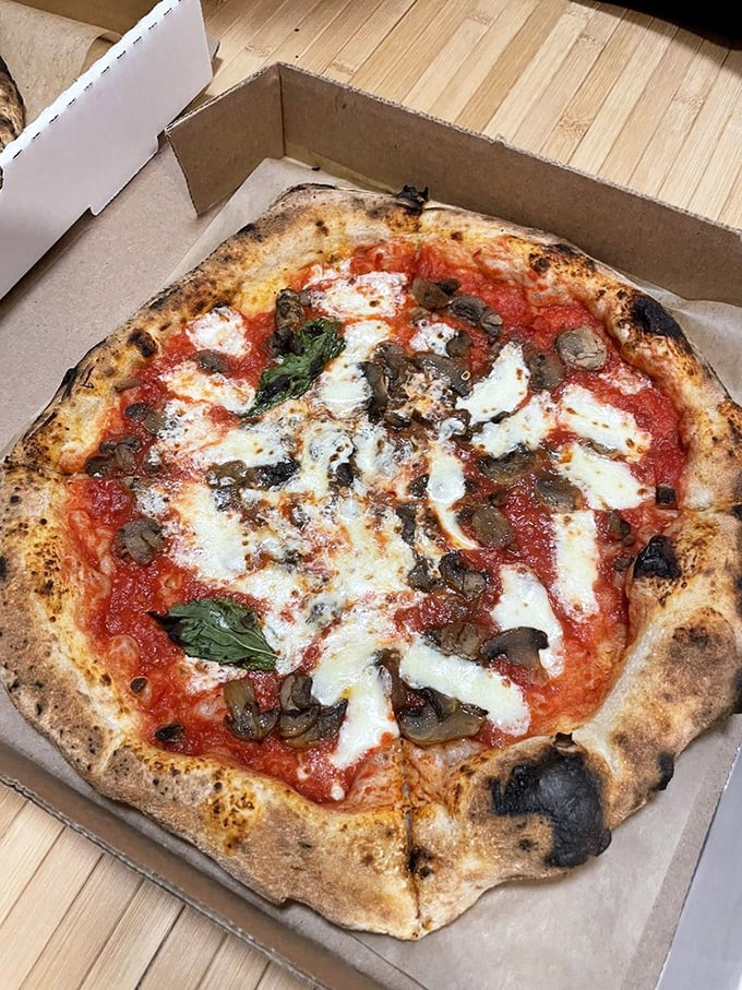 The Funghi Pizza proves that mushrooms aren't just for foraging hipsters—they're the umami bombs that make this pie unforgettable.