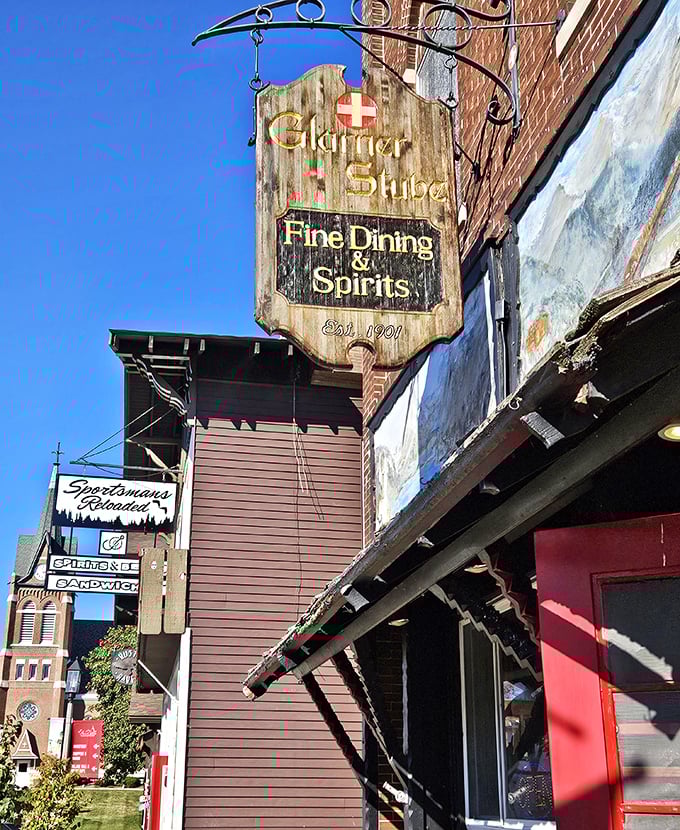 The Glarner Stube's weathered wooden sign promises "Fine Dining & Spirits" with authentic Swiss hospitality. Your taste buds are about to take a European vacation.