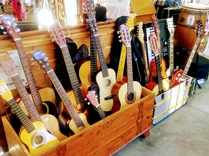 A guitarist's dream corner! These gently-used instruments wait patiently for new hands to strum them into their second act.