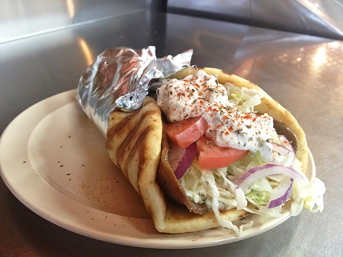 A proper gyro isn't just a sandwich—it's a handheld miracle of tzatziki, fresh vegetables, and seasoned meat wrapped in warm pita.