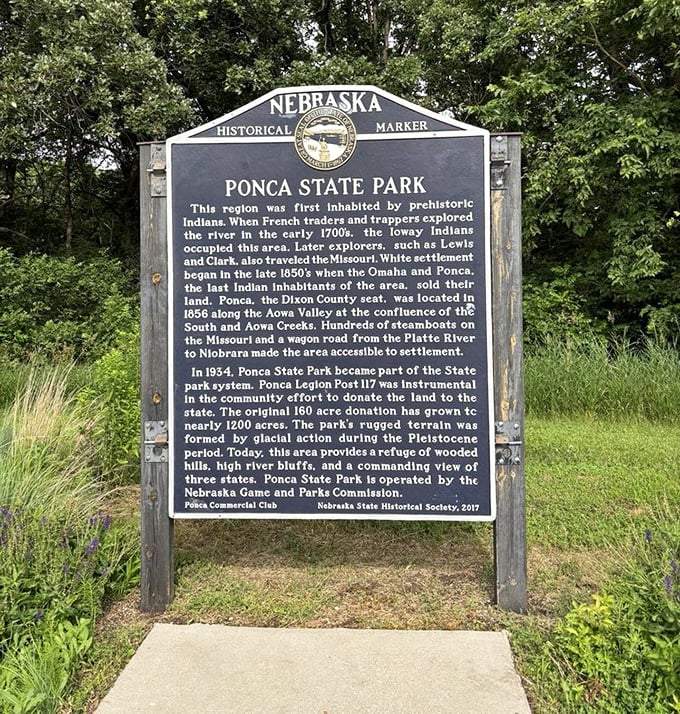 History carved in wood and metal. This marker tells the tale of how this land transformed from tribal territory to treasured park – a story worth pausing for.