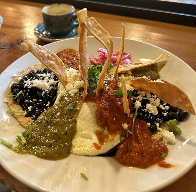 Huevos Rancheros reimagined as edible art—a symphony of sauces, textures, and flavors that dance across the plate.