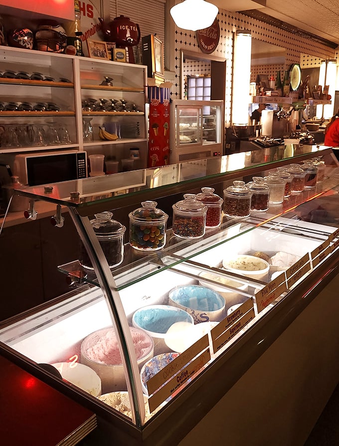 The ice cream display case—a frozen wonderland of homemade possibilities. Those candy jars standing guard ensure your sweet tooth has multiple satisfaction options.