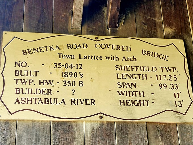 History condensed into a single plaque. Built in the 1890s, spanning 117.25 feet—numbers that barely capture the bridge's true significance.