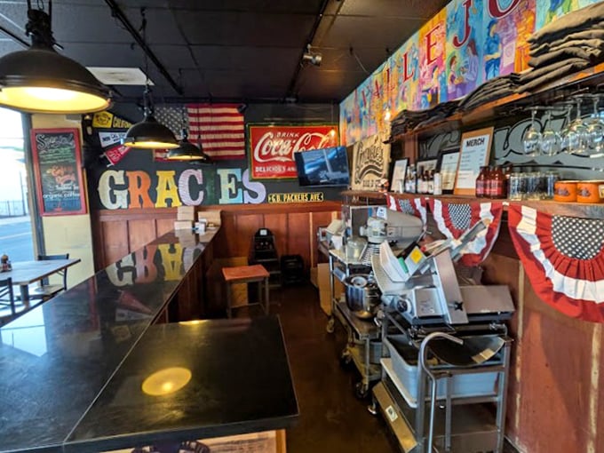 American flags, Coca-Cola signs, and BBQ equipment – the holy trinity of authentic smokehouse decor that signals you're in for the real deal.