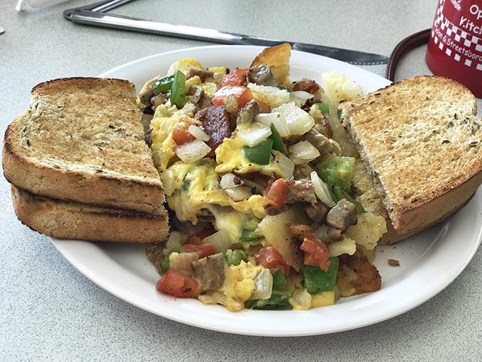 The Herb Nelson scramble—where eggs, veggies, and toast come together in a breakfast symphony that makes morning people of us all.