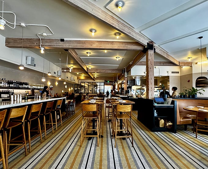 The striped floor pattern guides you through this welcoming space like a delicious yellow brick road to pizza paradise.