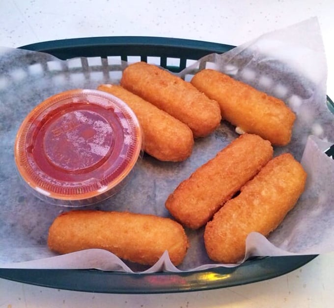 Mozzarella sticks that make you question why you ever bothered with fancy cheese plates—golden, crispy, and pulling the perfect cheese stretch.