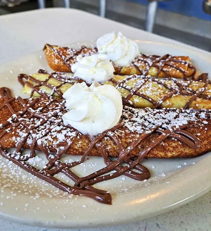 Nutella-drizzled French toast that doesn't just break your diet—it shatters it with such delicious authority you'll happily surrender.