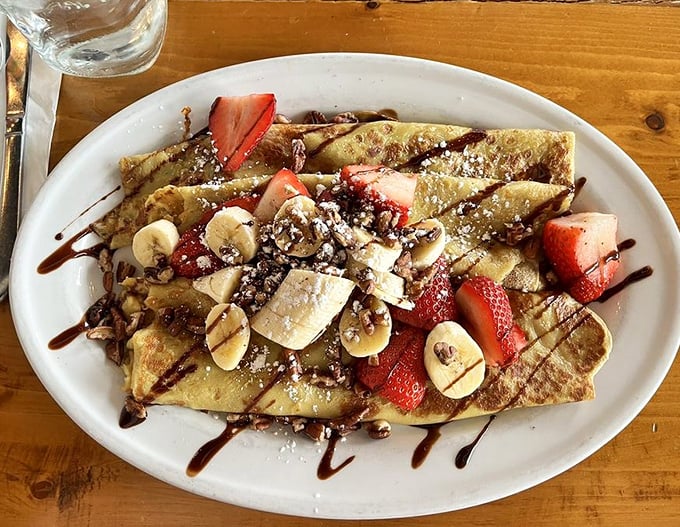 Crepes that make you question why we don't eat dessert for breakfast more often—thin, elegant, and draped in chocolate like a French fashion model. 