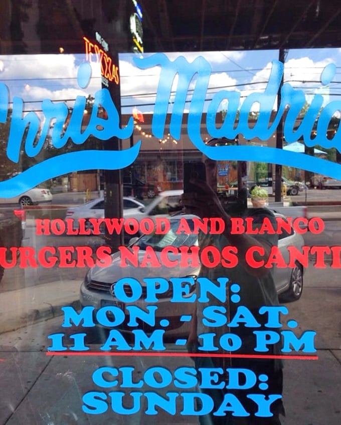 The window announces the hours like a challenge: "You have this much time to get here before you miss out." Challenge accepted.