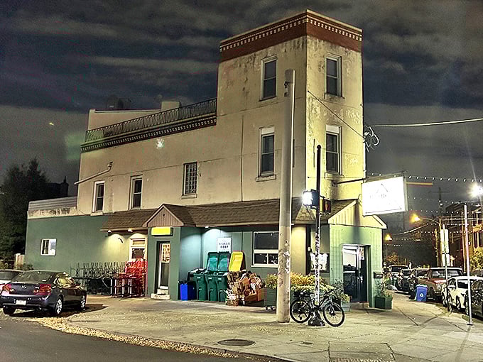 As night falls, Triangle Tavern glows with promise – a neighborhood lighthouse guiding hungry souls toward comfort food and cold drinks.