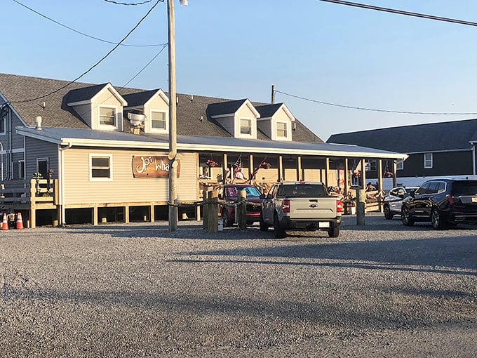 Sunset casts a golden glow on JP's Wharf, transforming this humble seafood haven into a postcard-perfect scene. The calm before the dinner rush.