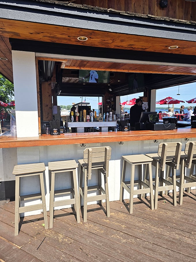 The outdoor bar—where summer memories begin. Those white stools have supported countless happy hours and spontaneous friendships.