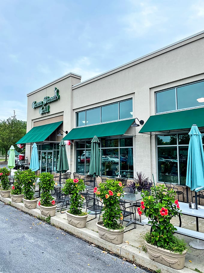 Outdoor seating framed by blooming flowers—nature's way of saying "your breakfast sandwich would taste even better in fresh air."